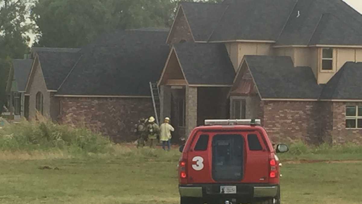 Crews battle Mustang house fire caused by lightning strike
