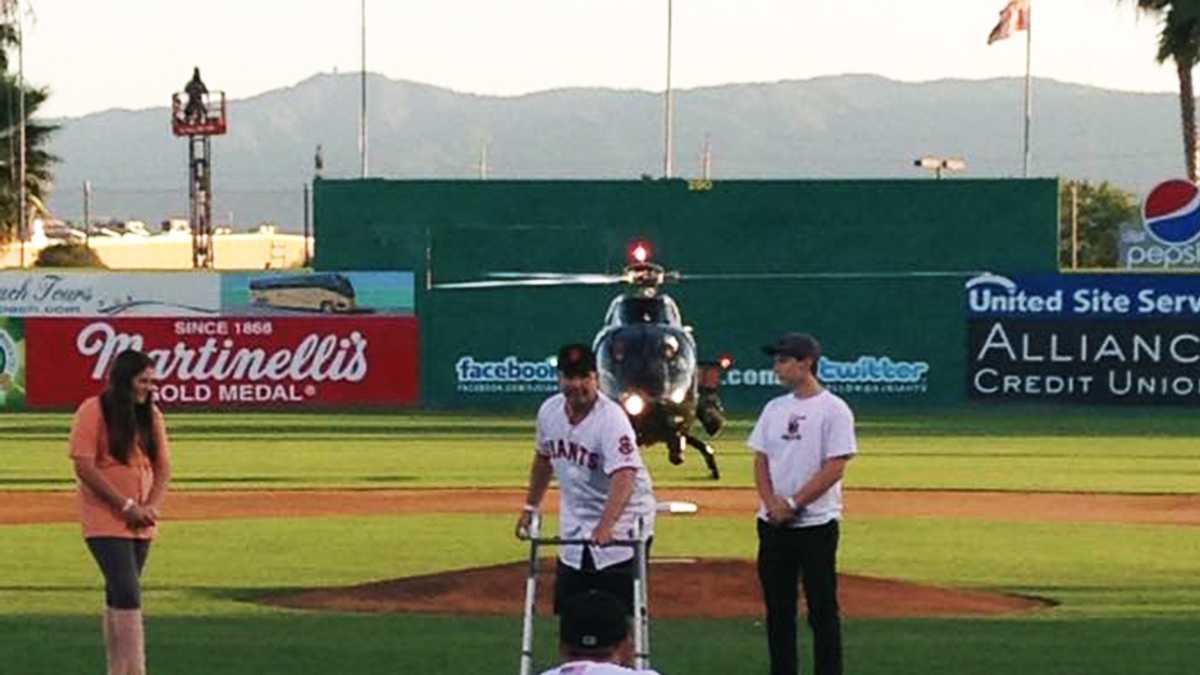 Giants fan Bryan Stow throws first pitch