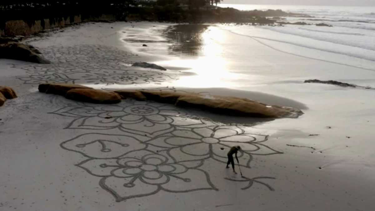 Sand artist on Carmel Beach creates beauty with nature