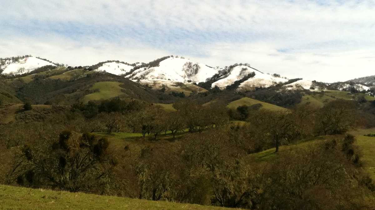 Snow gleaming on Salinas, Carmel mountain skylines