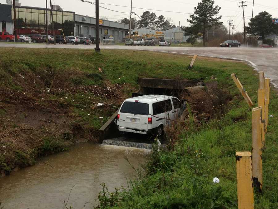 Van runs off road, gets stuck in culvert