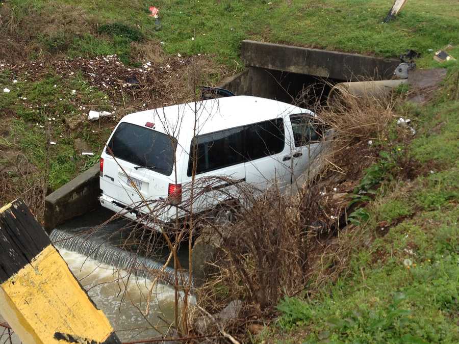 Van runs off road, gets stuck in culvert