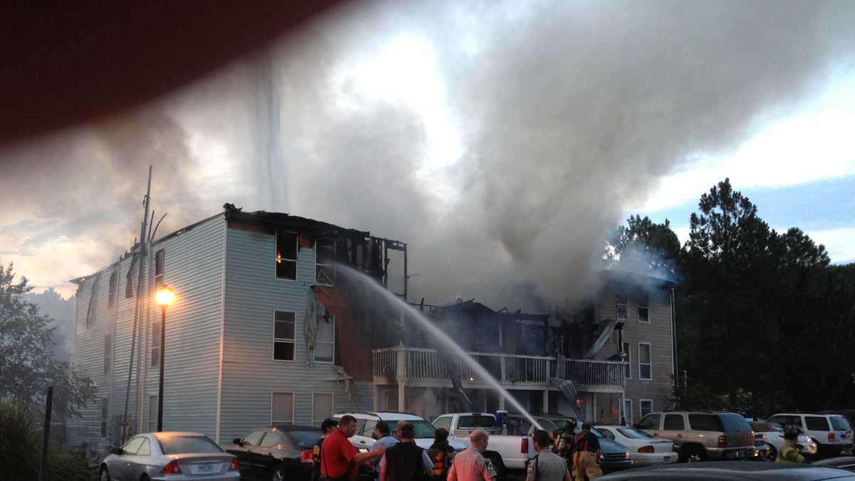 Burned apartment building demolished