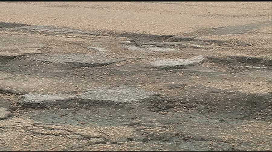 Path of potholes covers street in Jackson