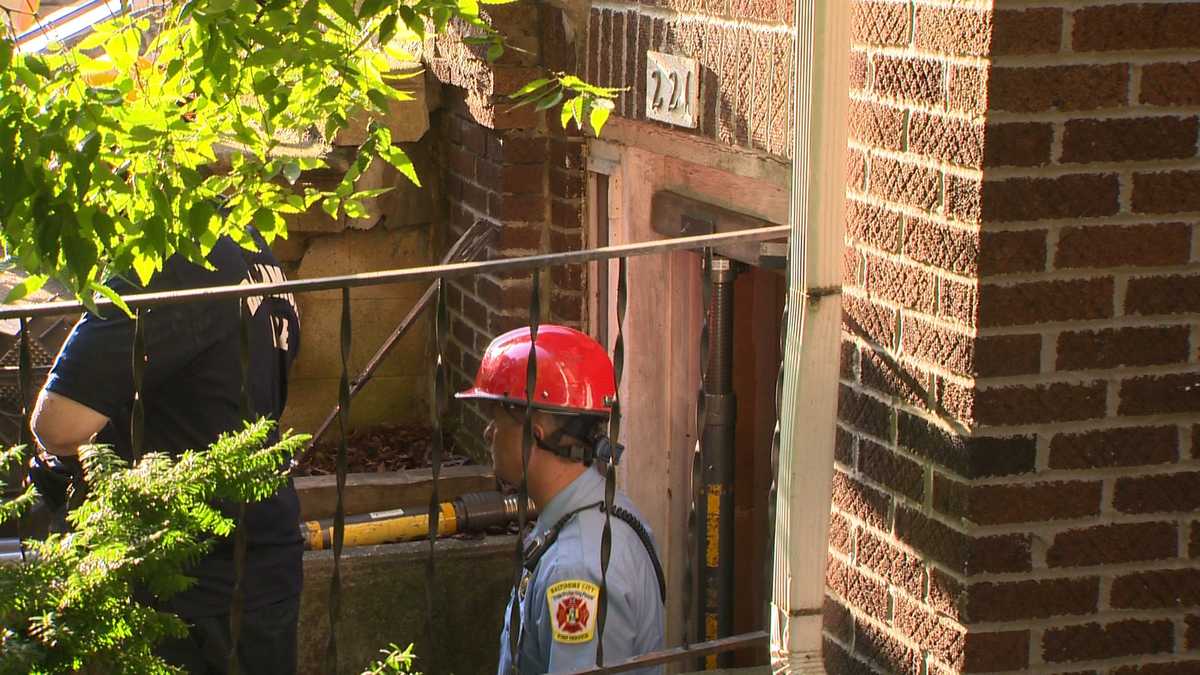 Images: Porch collapse drops 2 into basement