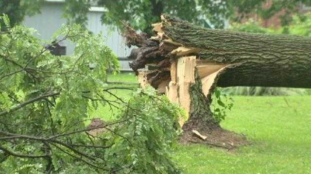 Images: Storms destroy buildings, uproot trees, flood streets
