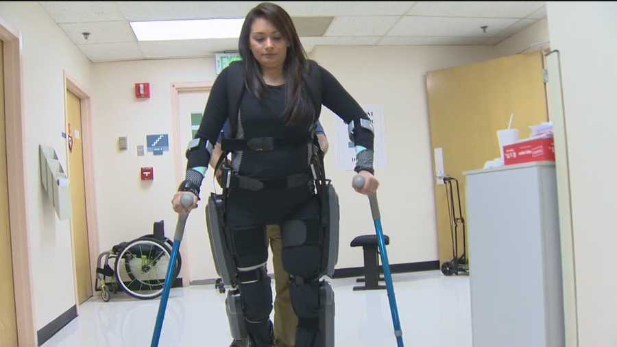 Paralysis patient walks again using robotic device