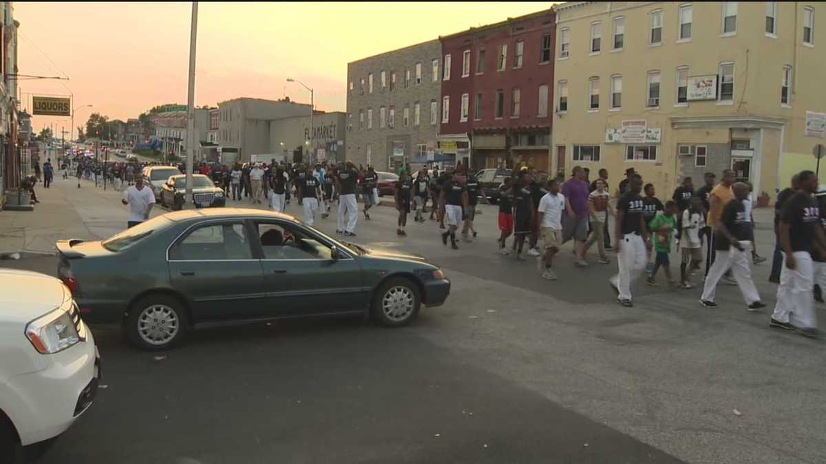 Hundreds march in Baltimore against violence