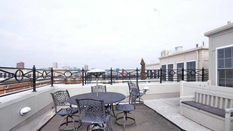 Enjoy harbor views from your rooftop deck in this Baltimore townhome