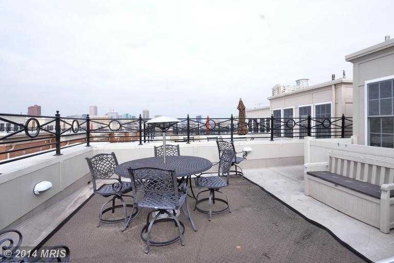 Enjoy harbor views from your rooftop deck in this Baltimore townhome