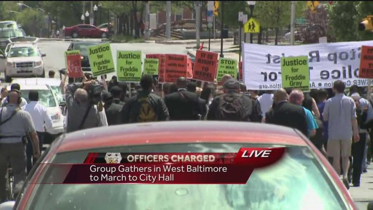 Images: Ralliers converge outside Baltimore City Hall
