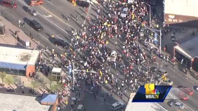 Images: Ralliers converge outside Baltimore City Hall