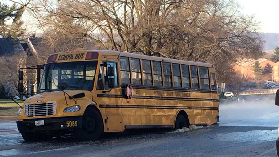 School bus gets stuck in sinkhole