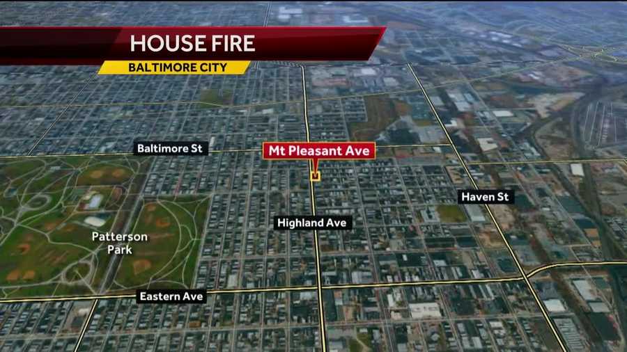Crews battle house fire in southeast Baltimore
