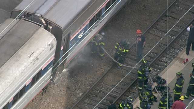 Baltimore crews extinguish fire outside train