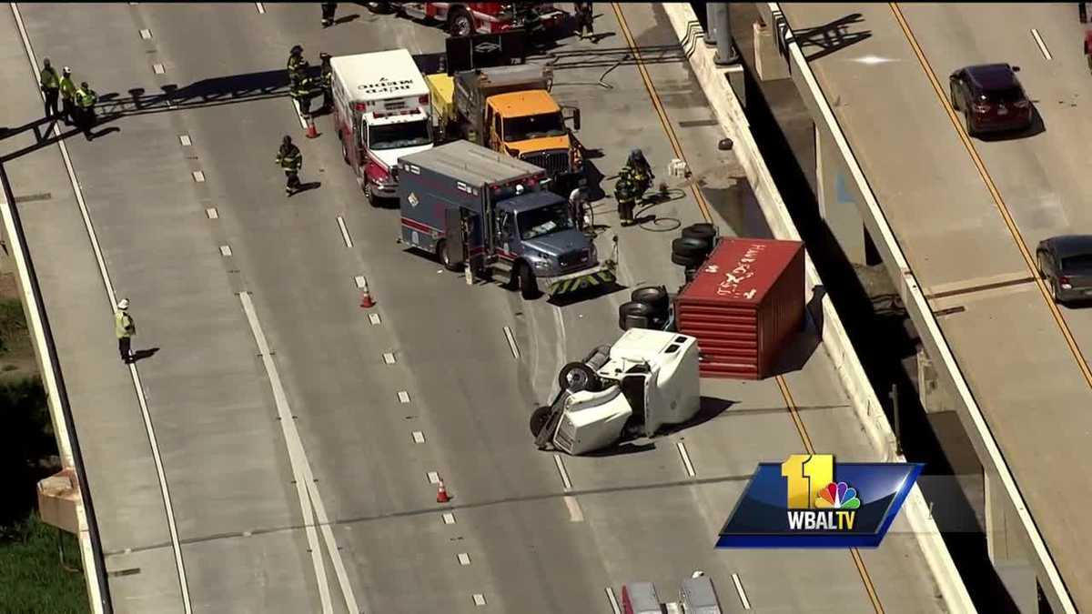Overturned tractor-trailer impacts I-95 traffic