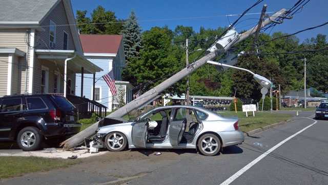 Car crashes into utility pole, injures 2