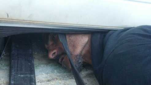 Man gets head stuck under door for hours