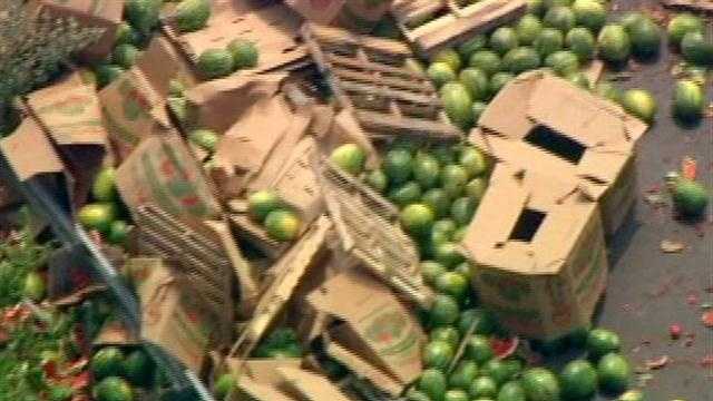 Images: Watermelon truck overturns, dumps load