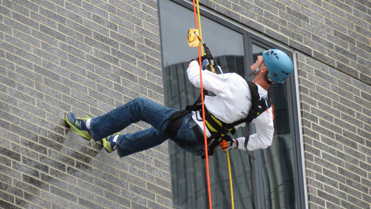 Images: Anthony and David rappel down Hub building