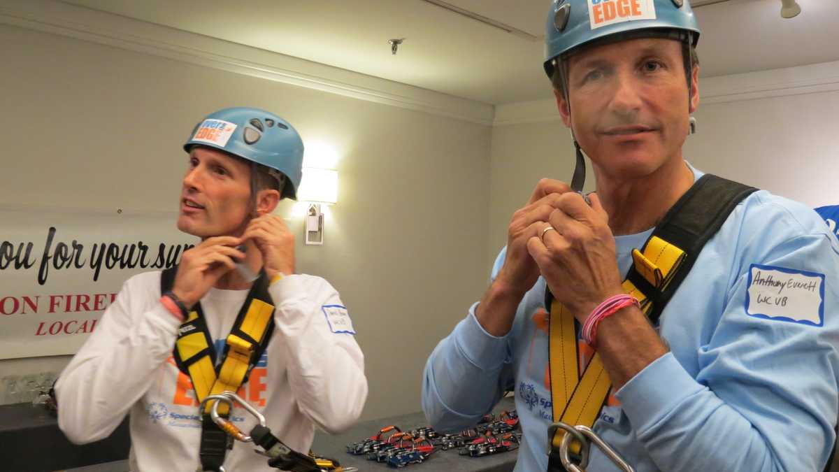 Images: Anthony and David rappel down Hub building
