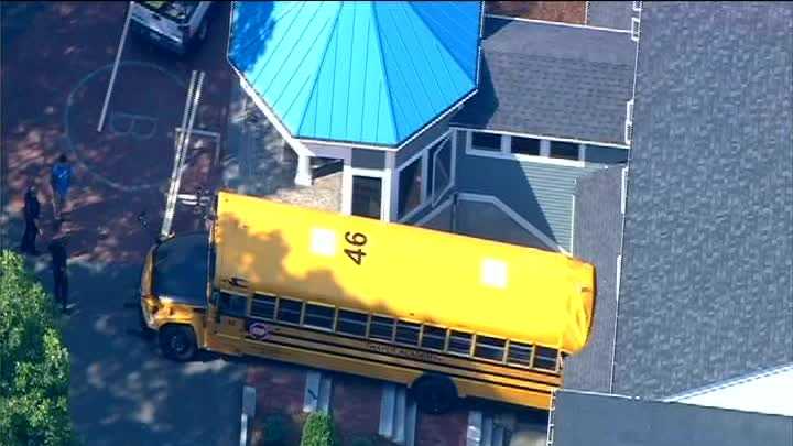 School bus smashes into building