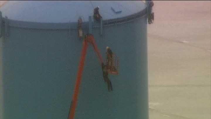 Frame-by-frame: workers rescued from water tower
