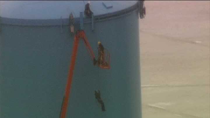 Frame-by-frame: workers rescued from water tower