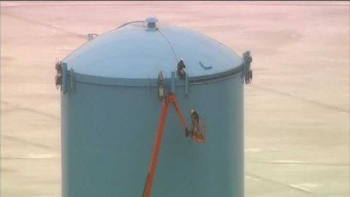Frame-by-frame: workers rescued from water tower