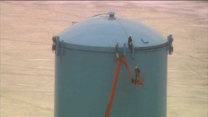Frame-by-frame: workers rescued from water tower