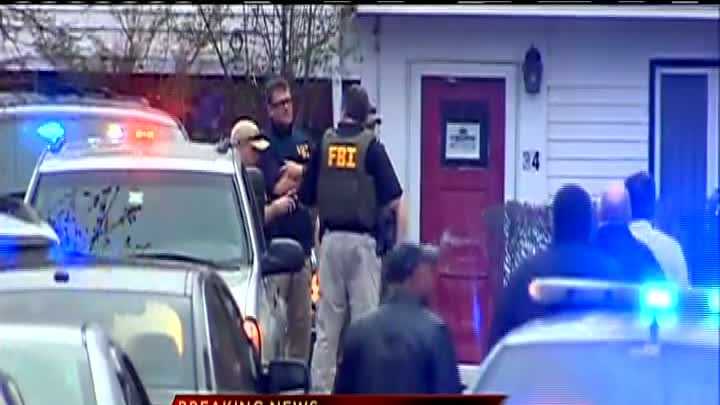 Photos: Police surround home after shots fired