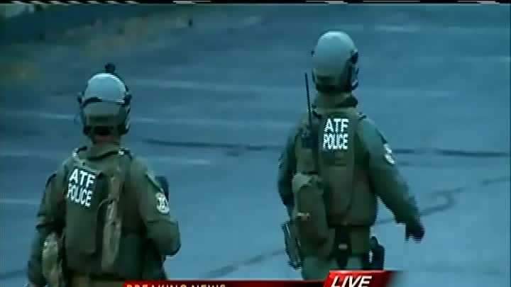 Photos: Police surround, capture suspect behind home