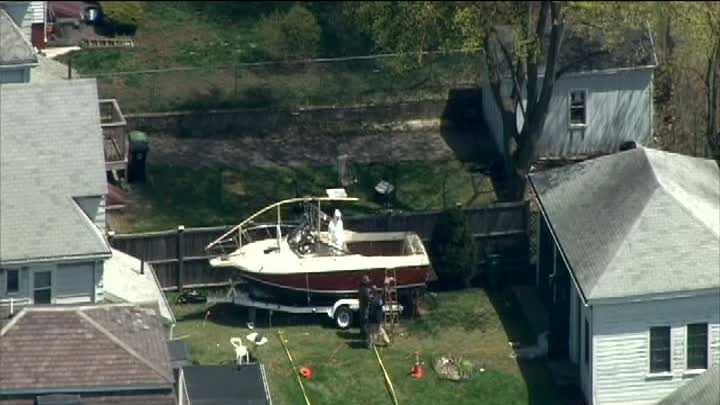 Photos: FBI searches boat where suspect was found