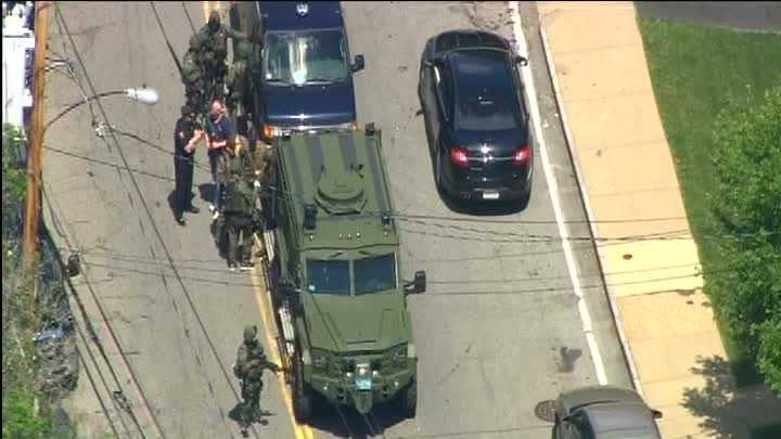 Photos: Swat team surround home in neighborhood