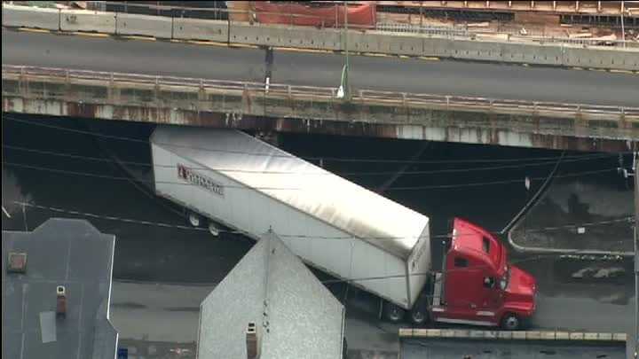 Photos: Truck stuck under highway bridge