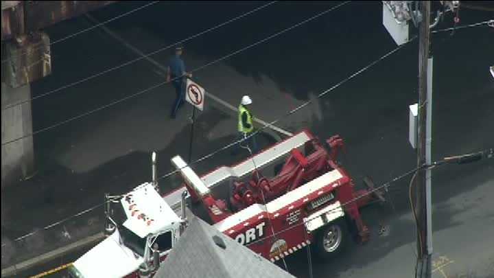 Photos: Truck stuck under highway bridge