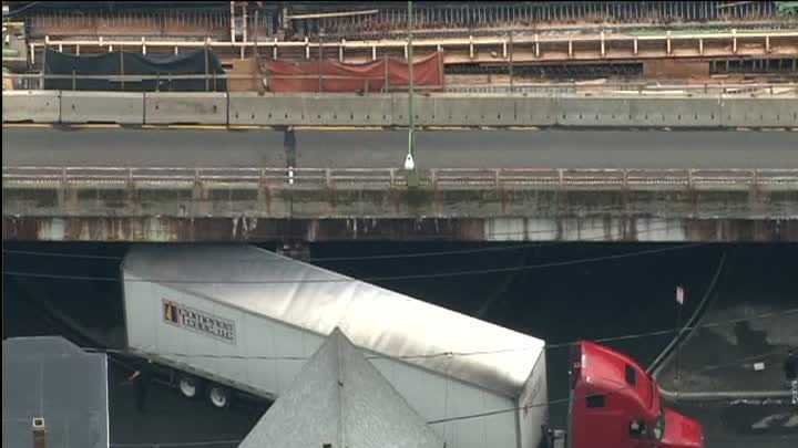 Photos: Truck stuck under highway bridge