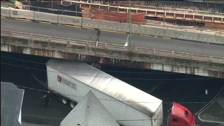 Photos: Truck stuck under highway bridge