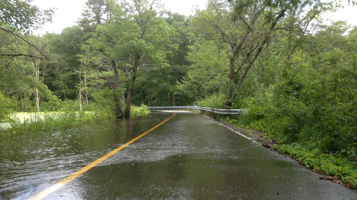 Rivers overflow banks, flood yards and roads