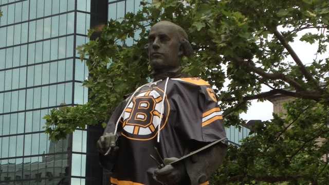 Photos: Historic Boston statues show Bruins pride