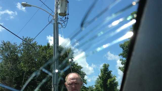 Driver survives rock thrown into windshield
