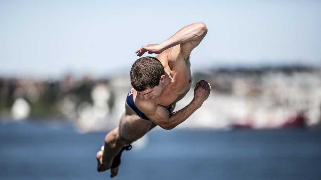 Divers jump from 90 feet above Boston Harbor