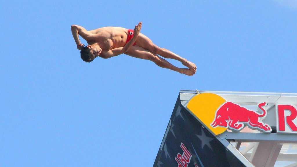 Divers jump from 90 feet above Boston Harbor