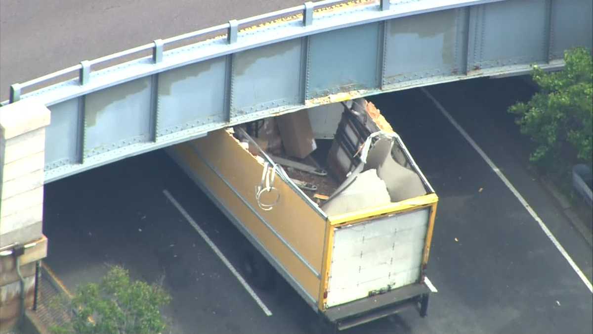 Truck stuck under Storrow Drive bridge