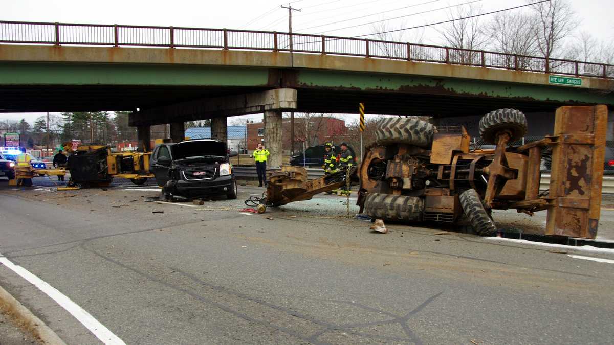 Images: Backhoe crashes onto Route 1
