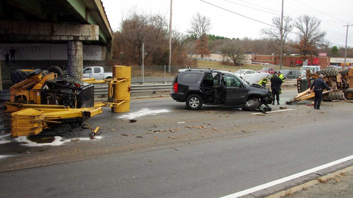 Images: Backhoe crashes onto Route 1