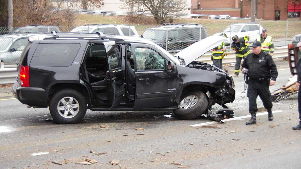 Images: Backhoe crashes onto Route 1