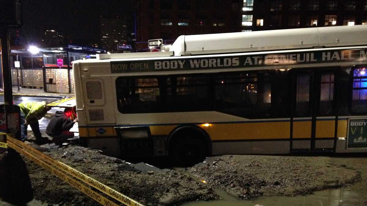 MBTA bus stuck in South Boston sinkhole