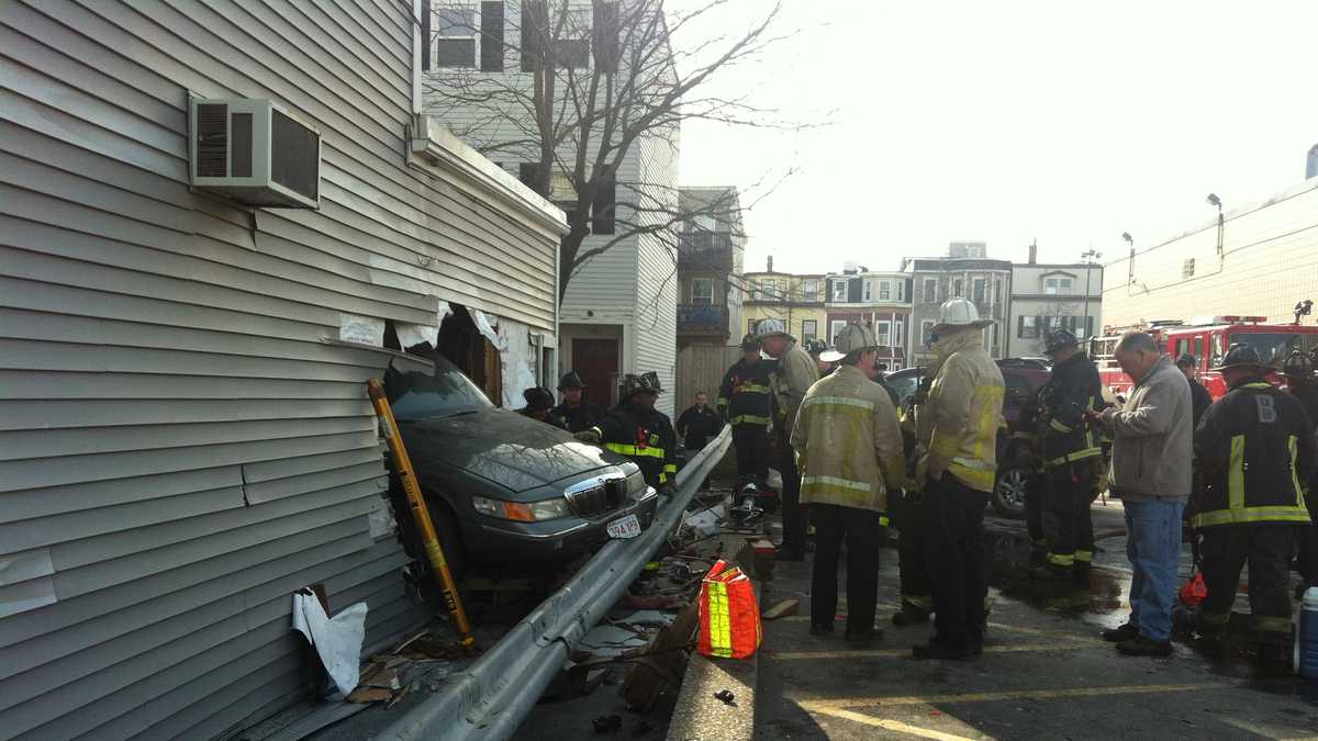 Photos of car crash into building