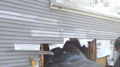 Photos of car crash into building